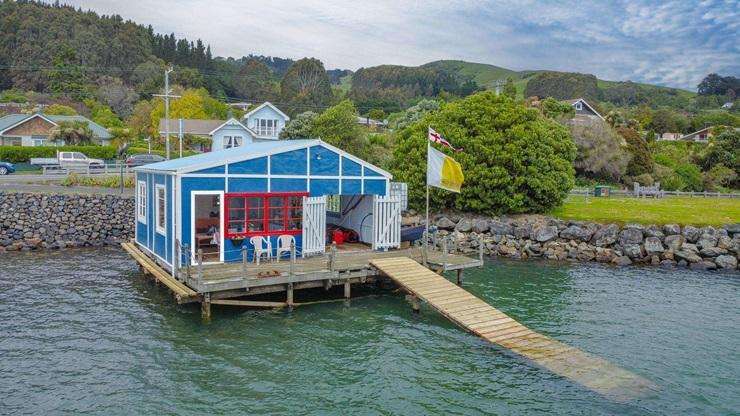 Iconic boatshed - with 'afternoon delight' - sells at the slap of a ...