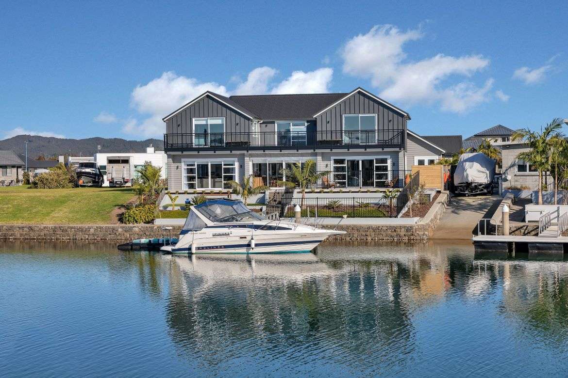 Magnificent home on One Tree Point canal for sale four months after ...